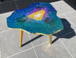 Artist makes wonderful epoxy resin art using crystals and precious stones