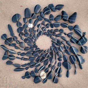Creates beautiful nature art with leaves, stones and shells ...
